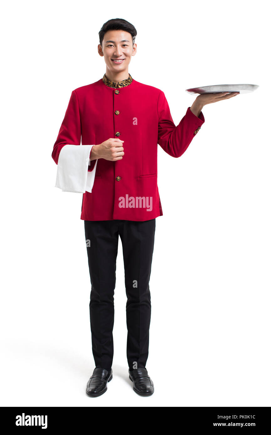 Cheerful young waiter serving food Stock Photo - Alamy