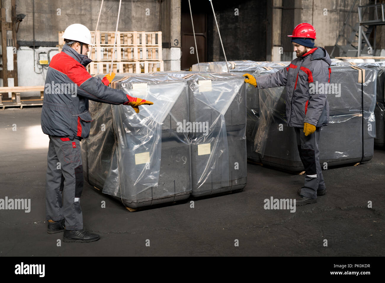 Workers Packing Construction Blocks Stock Photo - Alamy