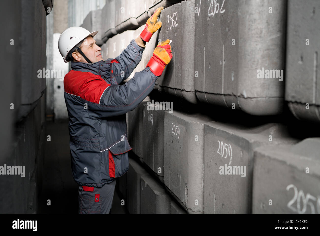 Worker Marking Blocks Stock Photo - Alamy