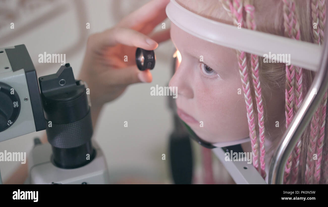 Eyesight check. Caucasian girl who have vision disabilities.Medical ...