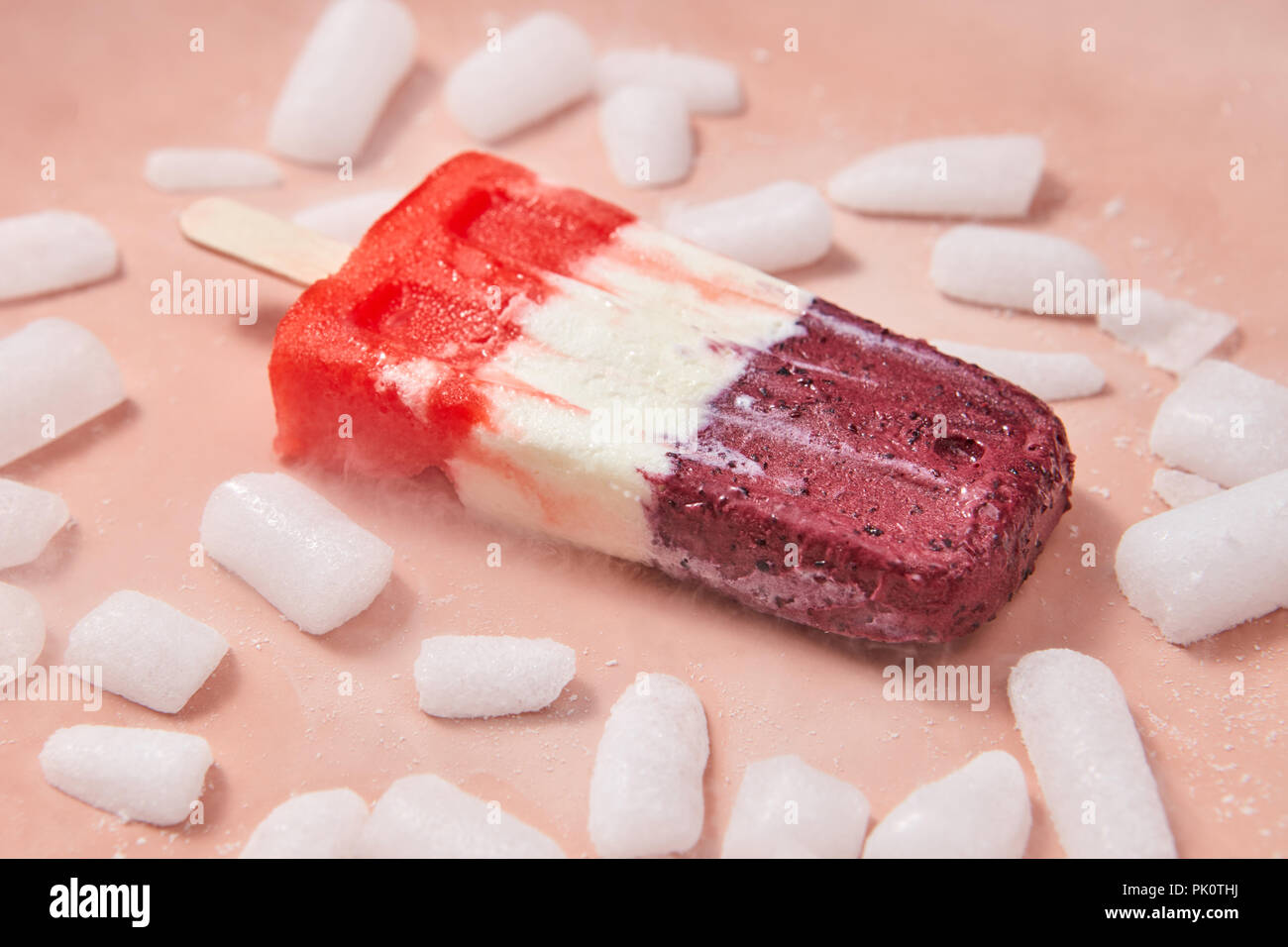 Colorful icy popsicle. Healthy diet ice cream from fruit puree on a ...
