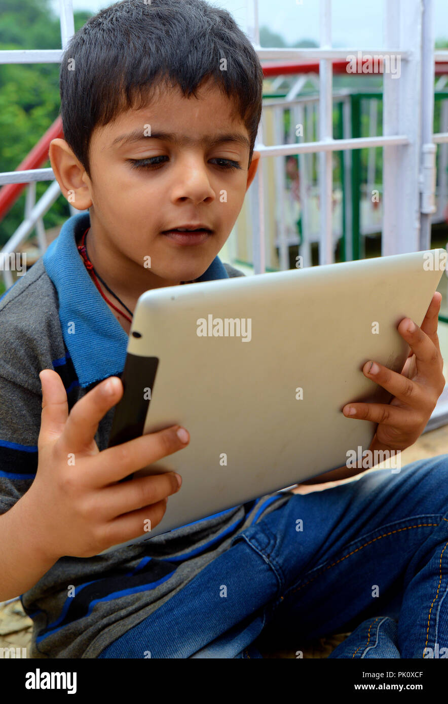 Boy using digital tablet Stock Photo - Alamy