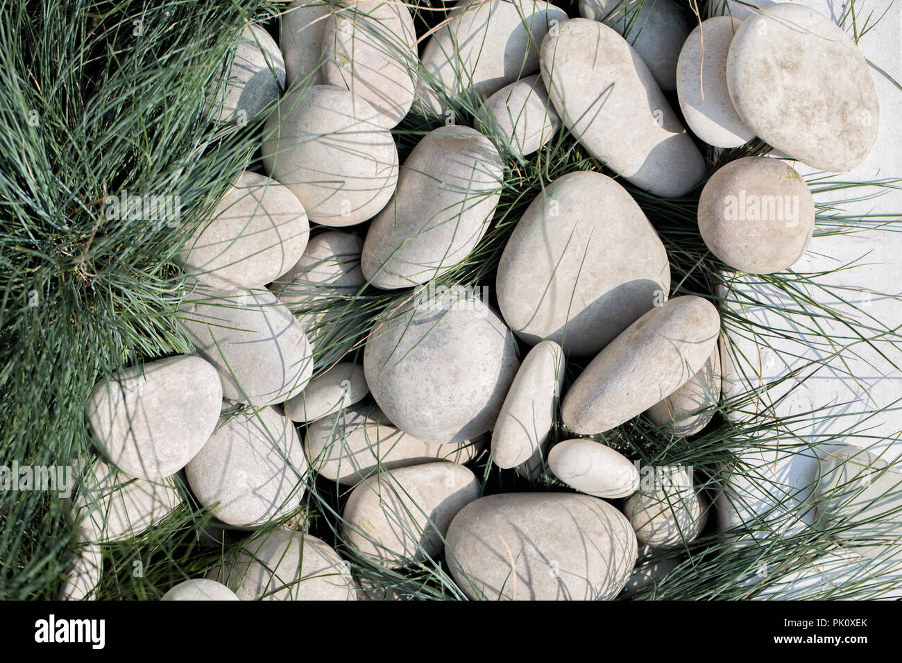 Background of round decorative cobblestone and green grass Stock Photo ...