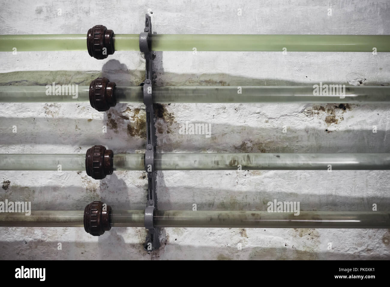 Glass pipeline on the wall for pumping wine at the winery Stock Photo ...