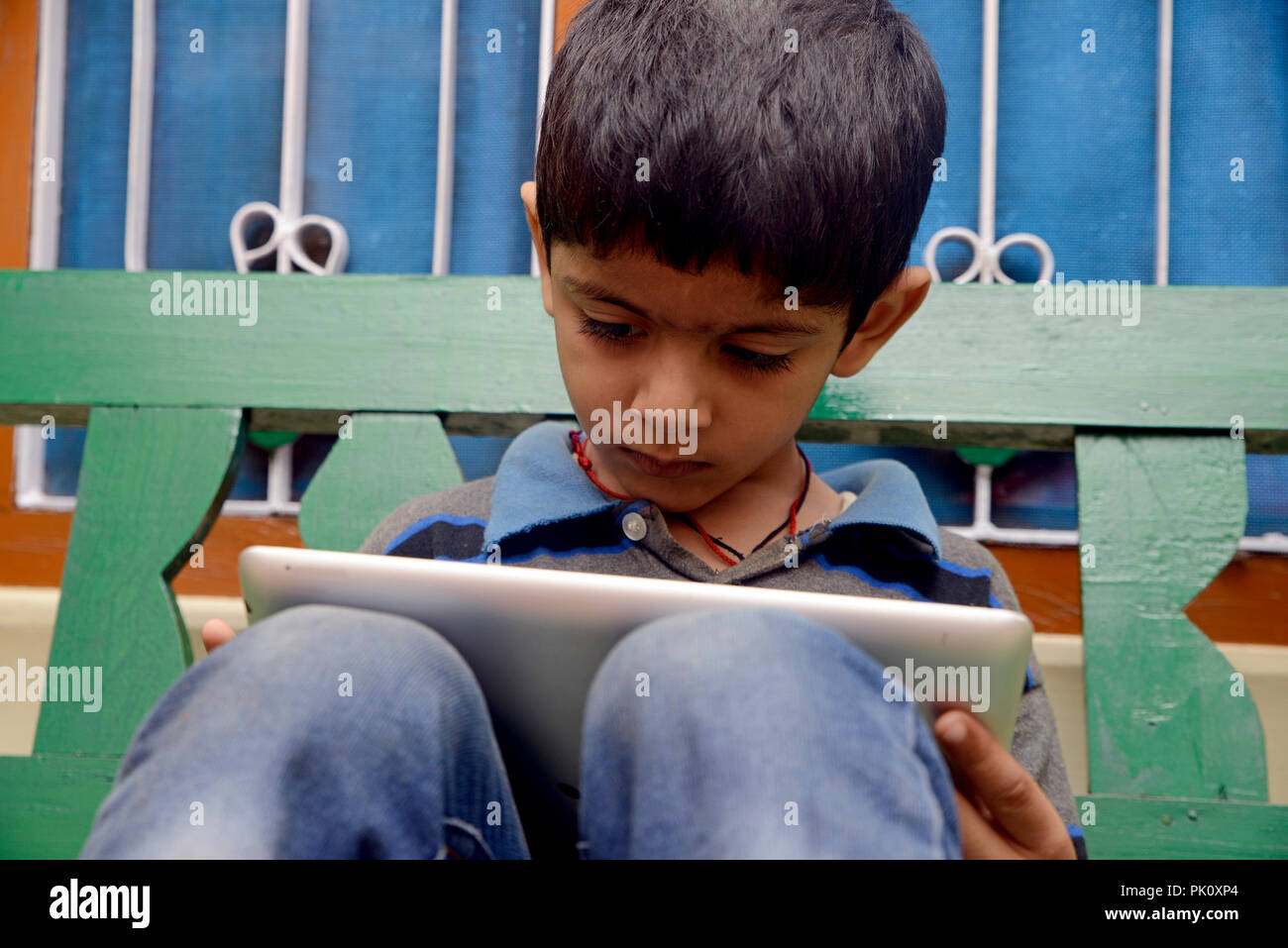 Boy using digital tablet Stock Photo - Alamy
