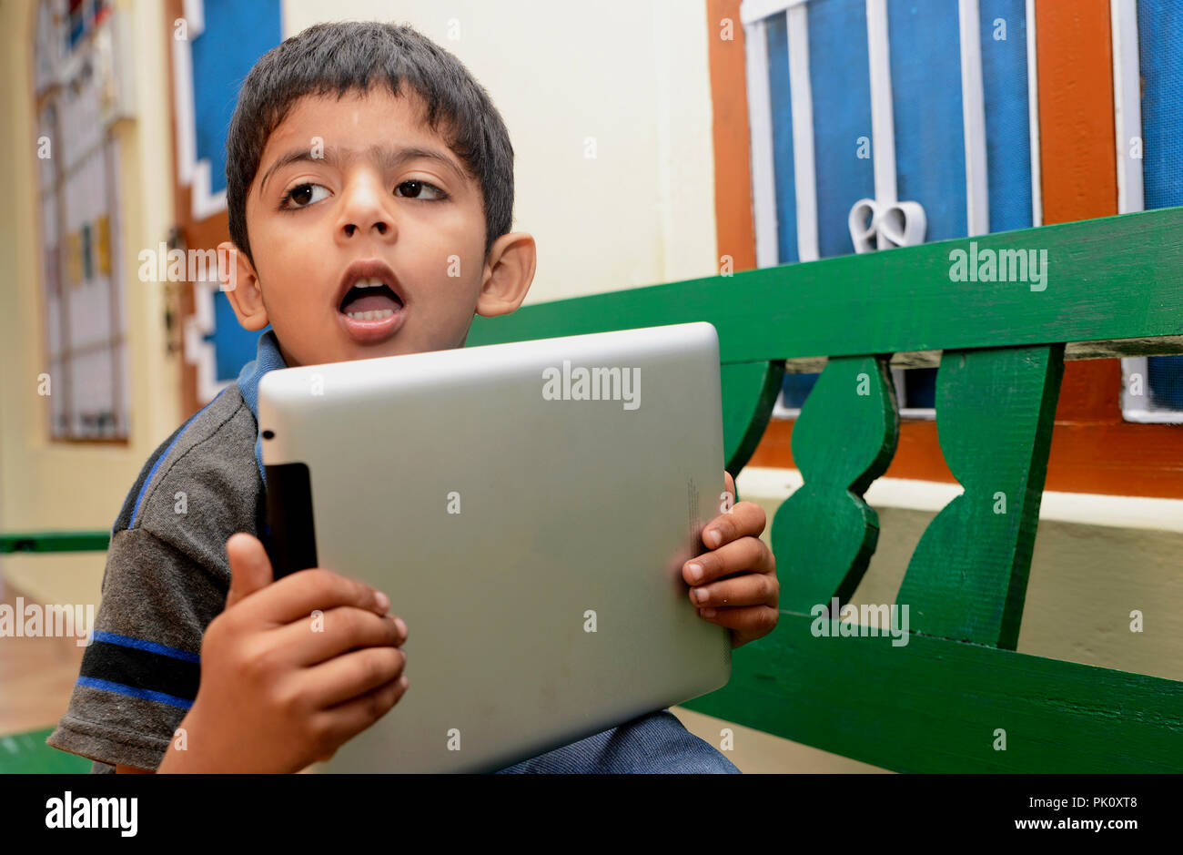 Boy using digital tablet Stock Photo - Alamy