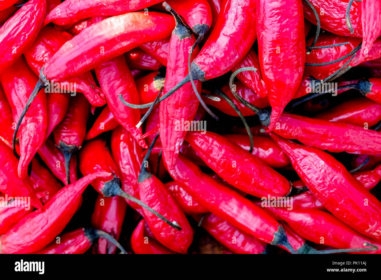 Three red chillies hi-res stock photography and images - Alamy