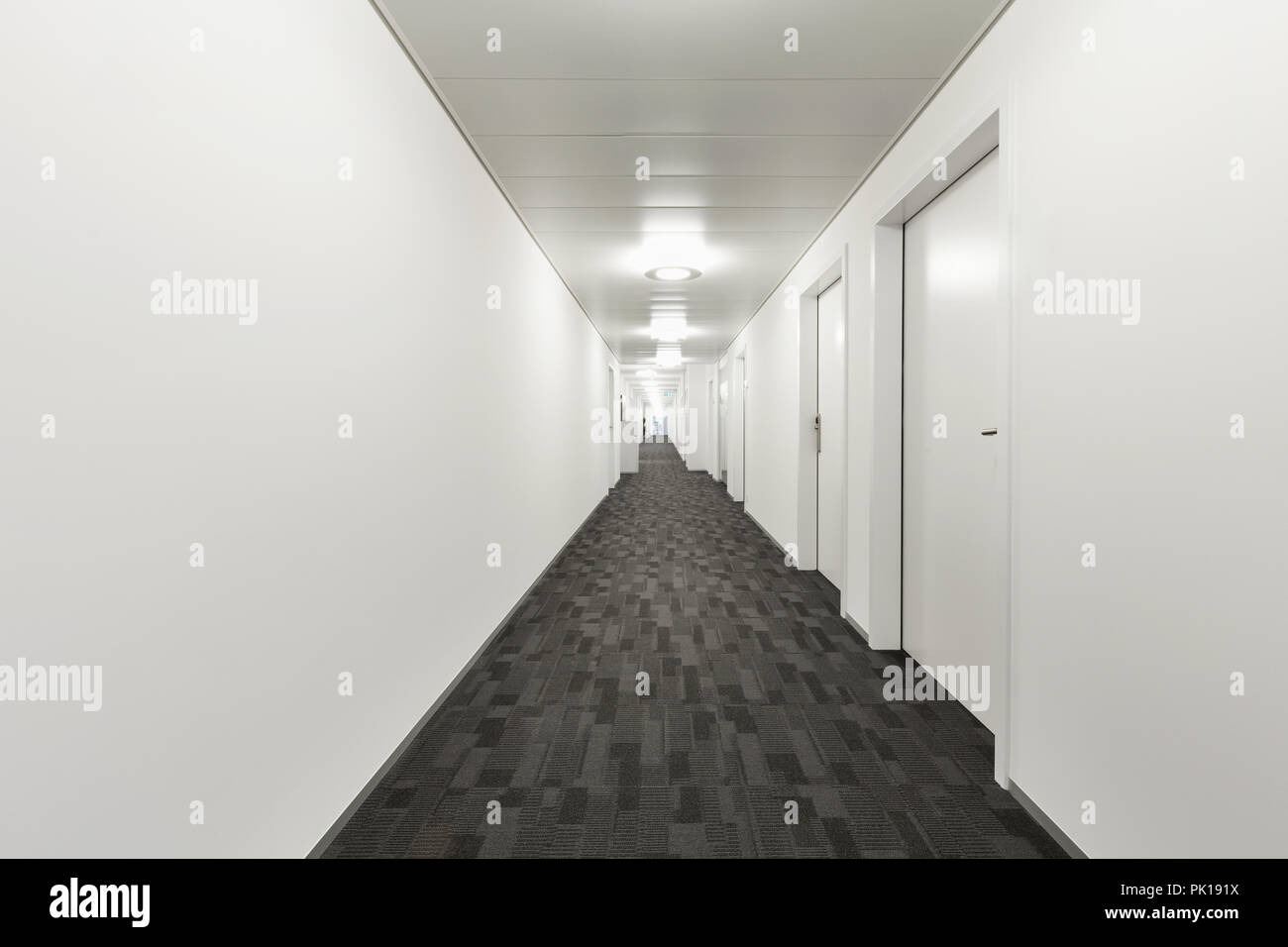 Interior, modern building, long corridor Stock Photo - Alamy
