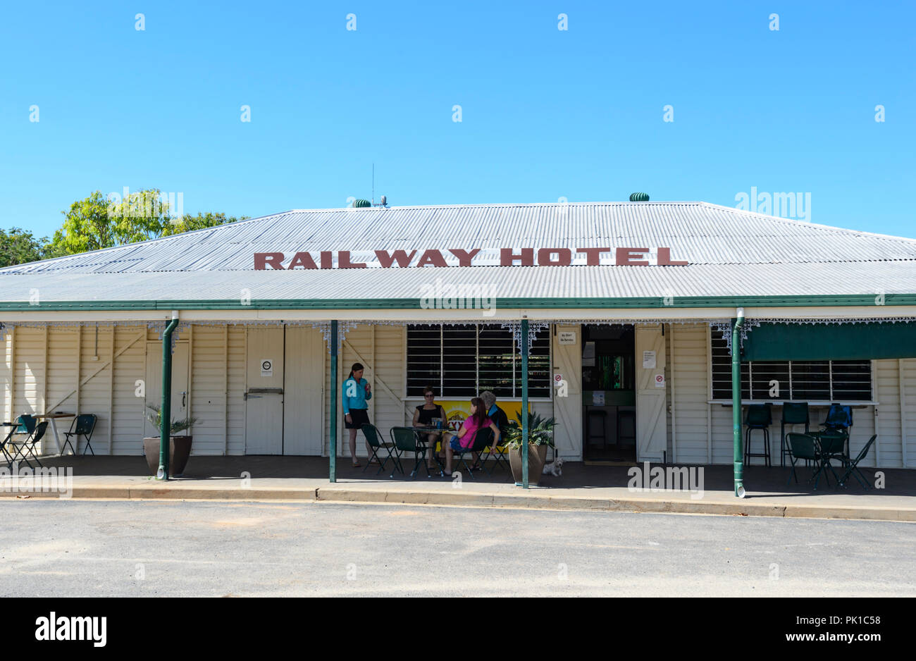People having a drink on the terrace of the old Almaden Railway Hotel ...