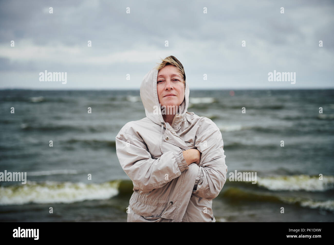 Woman windy jacket hi-res stock photography and images - Alamy