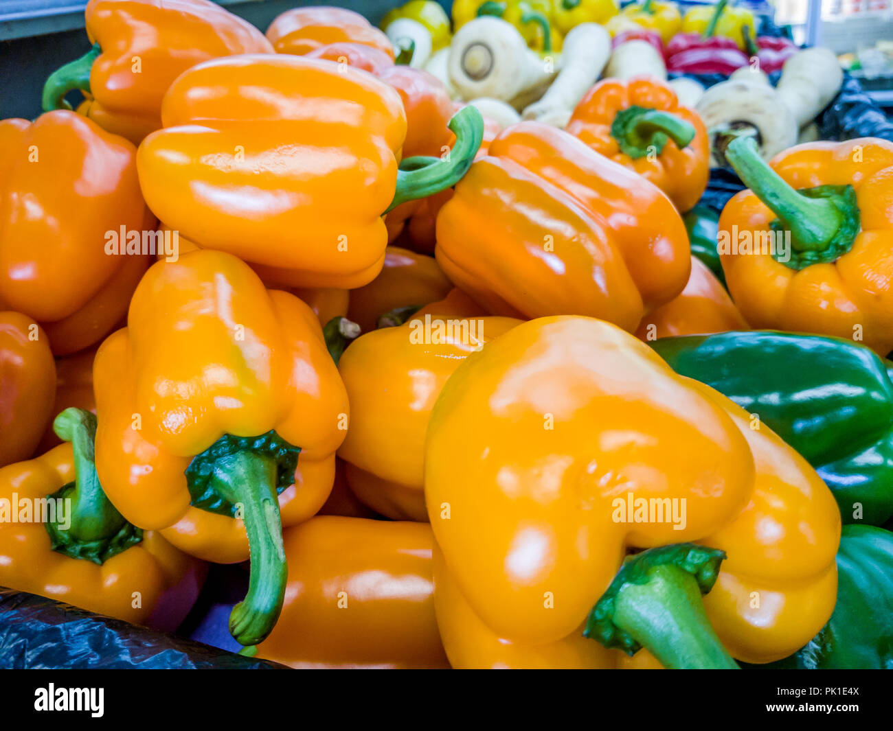 Fresh organic yellow peppers in a store Stock Photo - Alamy
