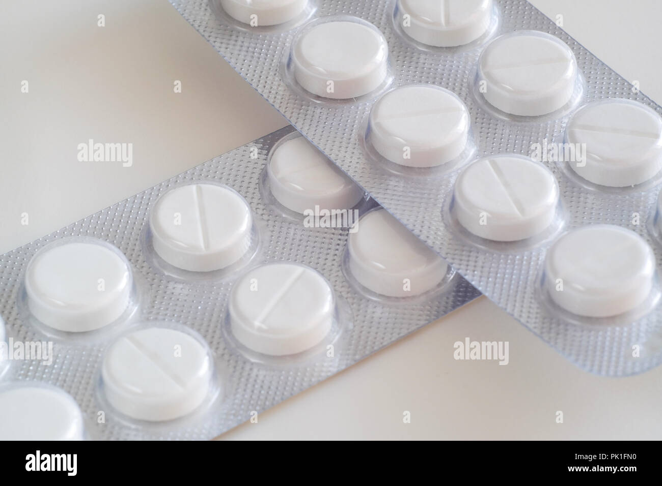 Medication pills. White pills, white background. A jar of pills Stock ...