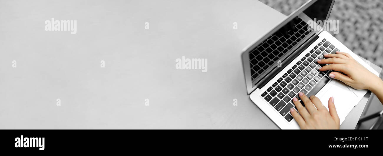 Website heading and banner of laptop with typing female hands, copy ...