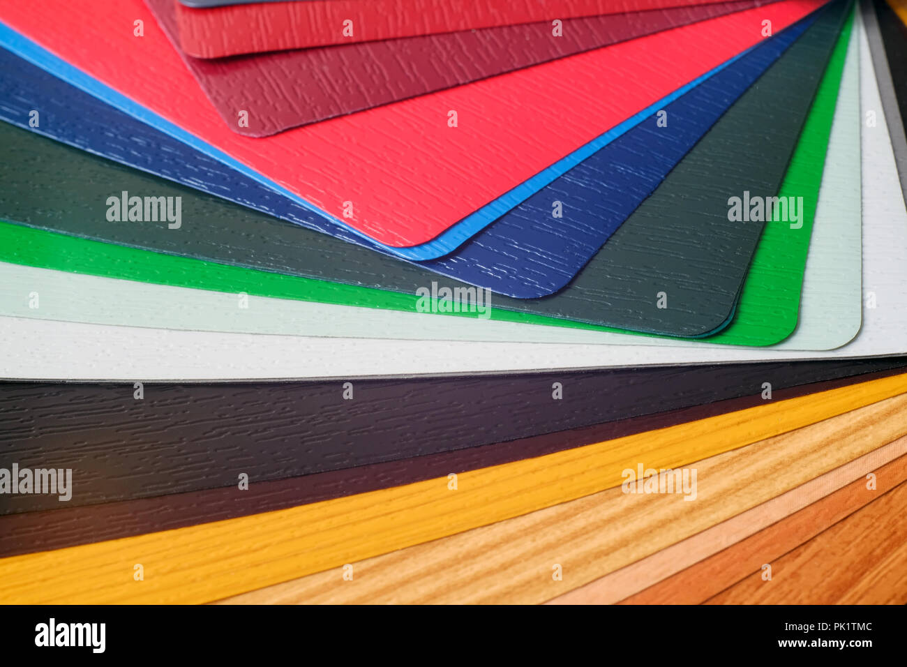 Samples of the colored lamination. Color palette on the table close-up ...
