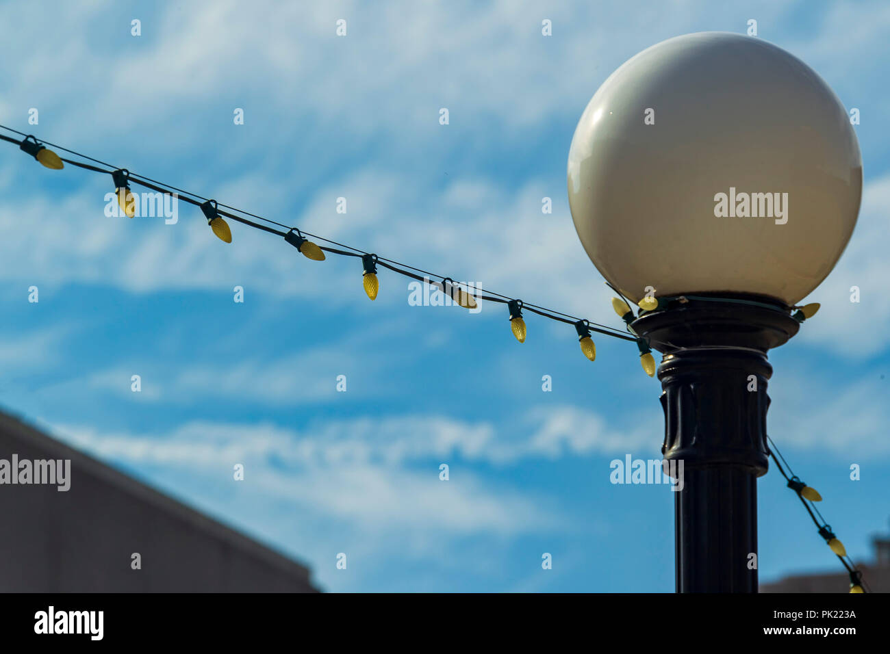 a street light and decorative lights used on a downtown street Stock ...