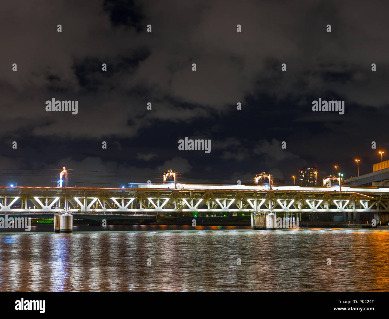 Long exposure picture of a train on a bridge over Sumida River, Asakusa ...