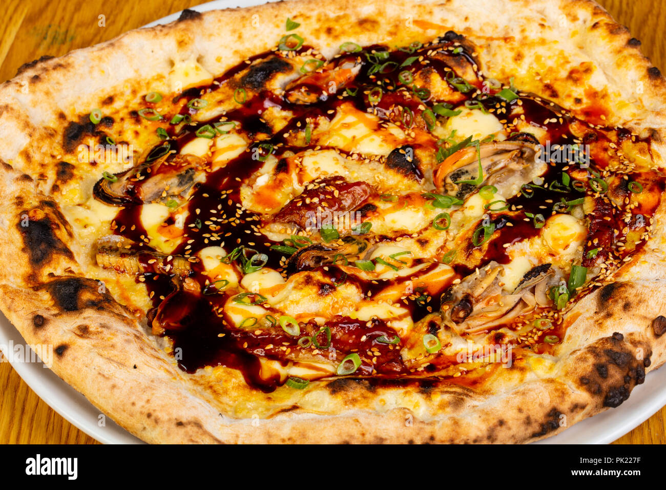 Pizza with eel and seafood Stock Photo - Alamy