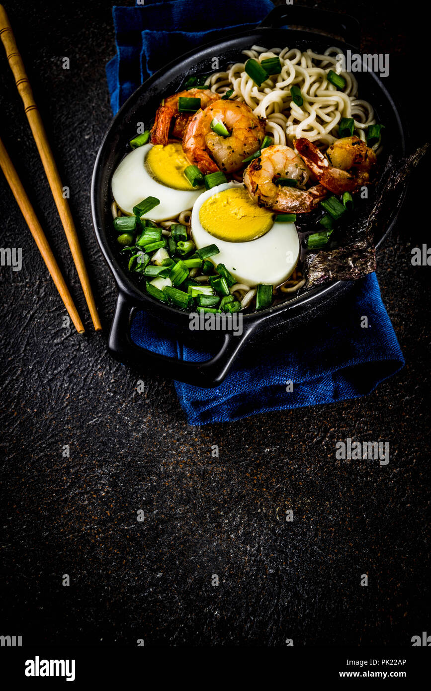 Traditional asian food, ramen soup with shrimp, noodles, spring onion ...
