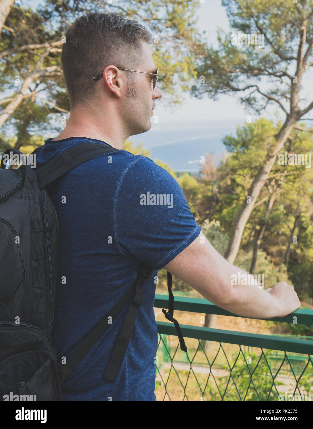 Male tourist with big rucksack on the hill Stock Photo - Alamy