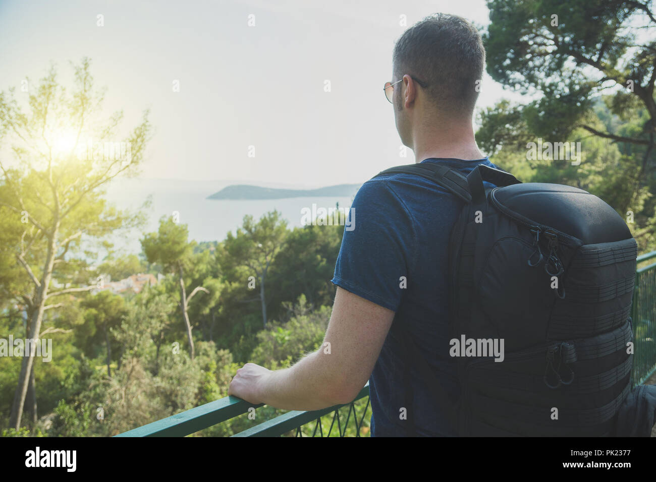 Male tourist with big rucksack on the hill Stock Photo - Alamy