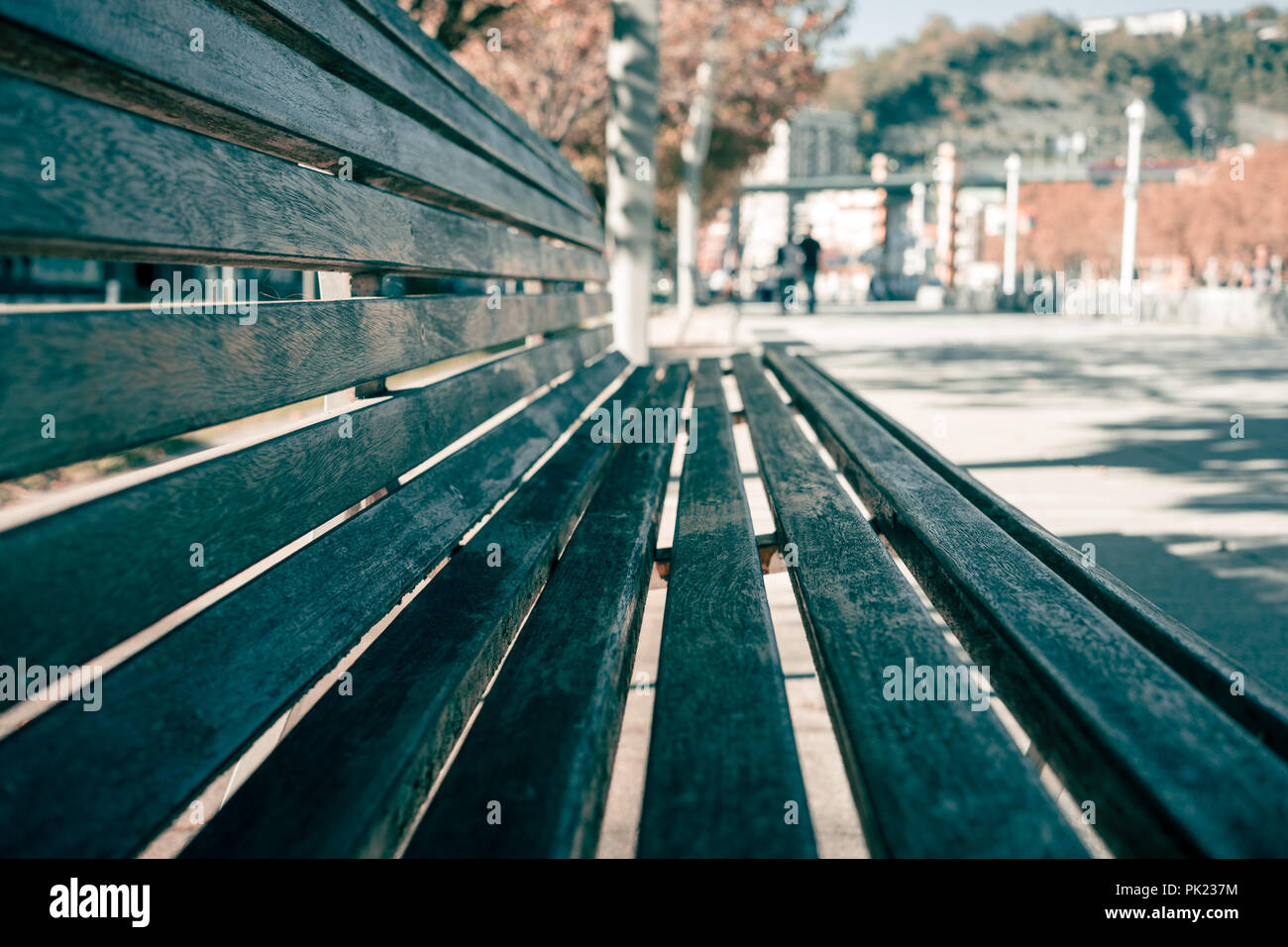 Park Bench in modern city street at sunny day Stock Photo - Alamy