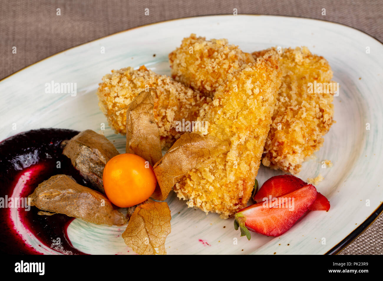 Roasted cheese sticks with jam Stock Photo - Alamy