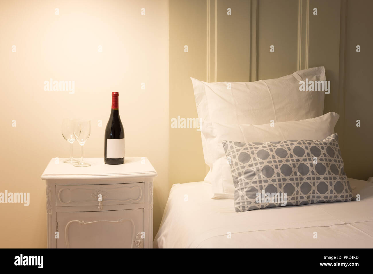 Wine bottle with wine glasses in a bedroom. Room service at the hotel ...