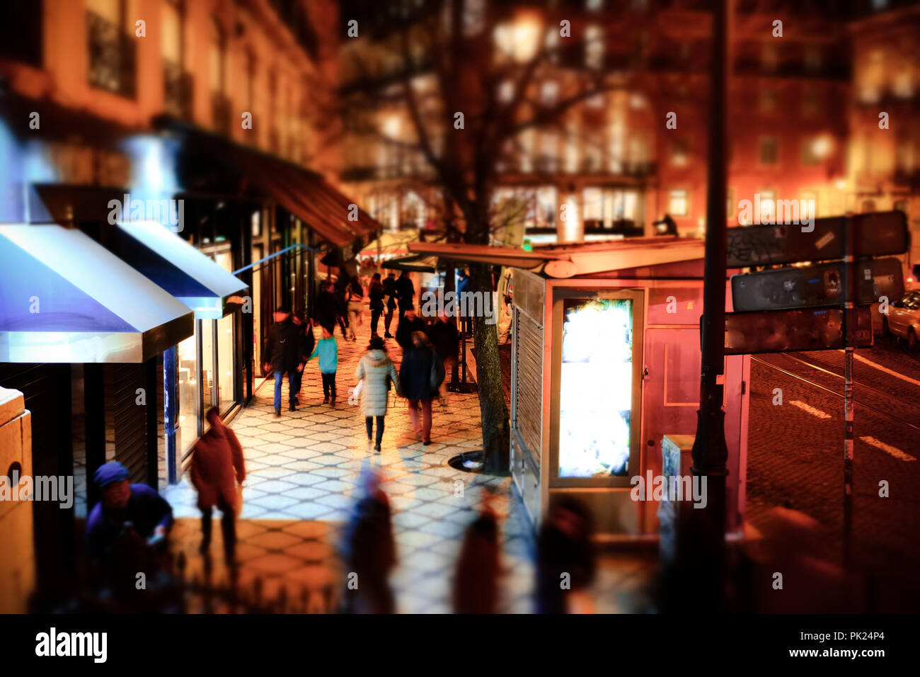 Illuminated street of old european town at night. Tilt-shift effect ...