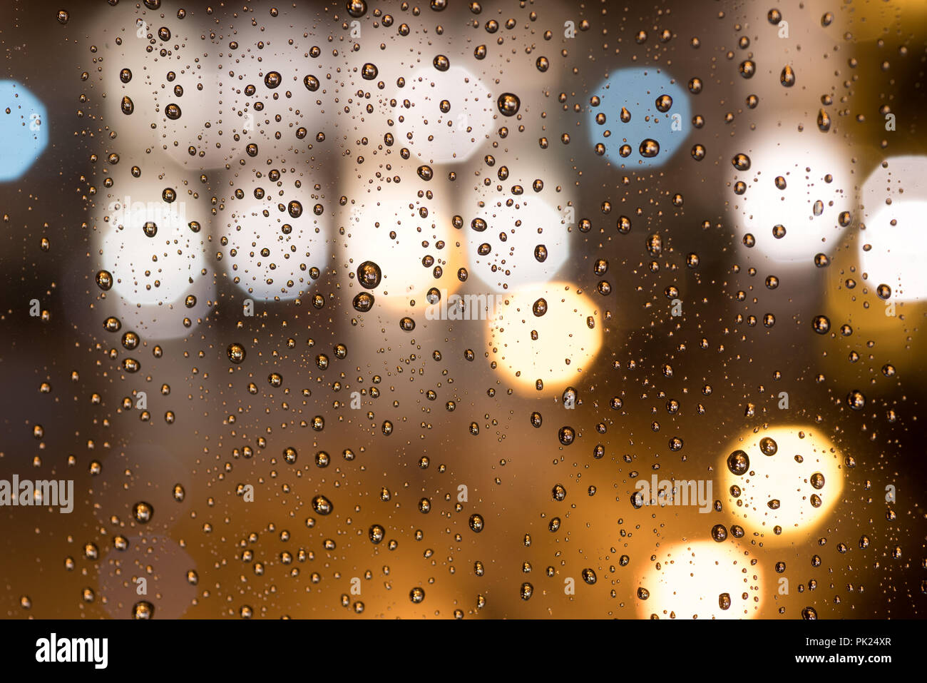 Drops of rain on window with abstract bokeh background Stock Photo - Alamy