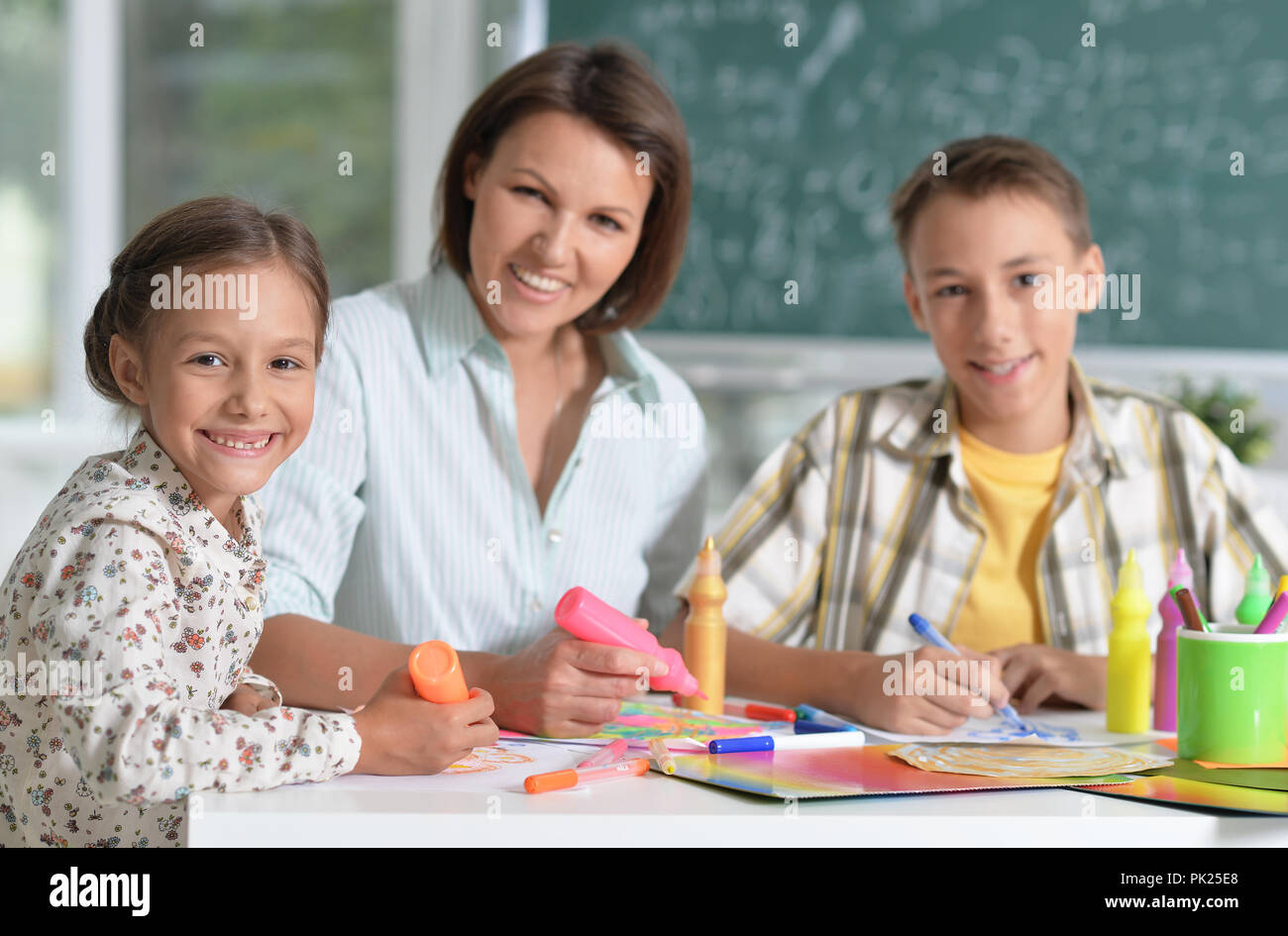 Portrait of children at school in the classroom Stock Photo - Alamy