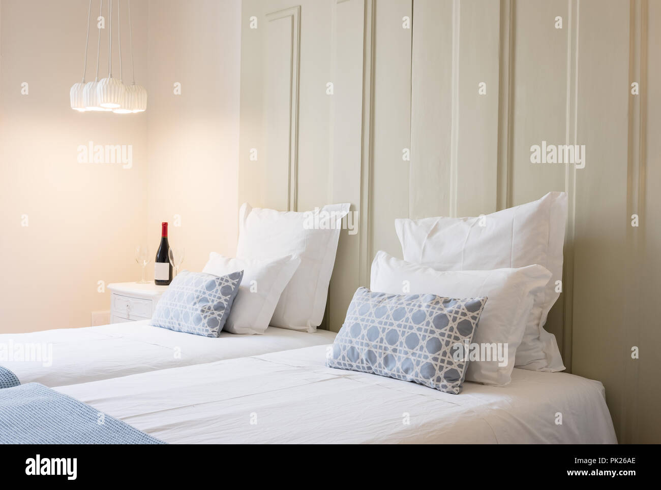 Wine bottle with wine glasses in a bedroom. Room service at the hotel ...