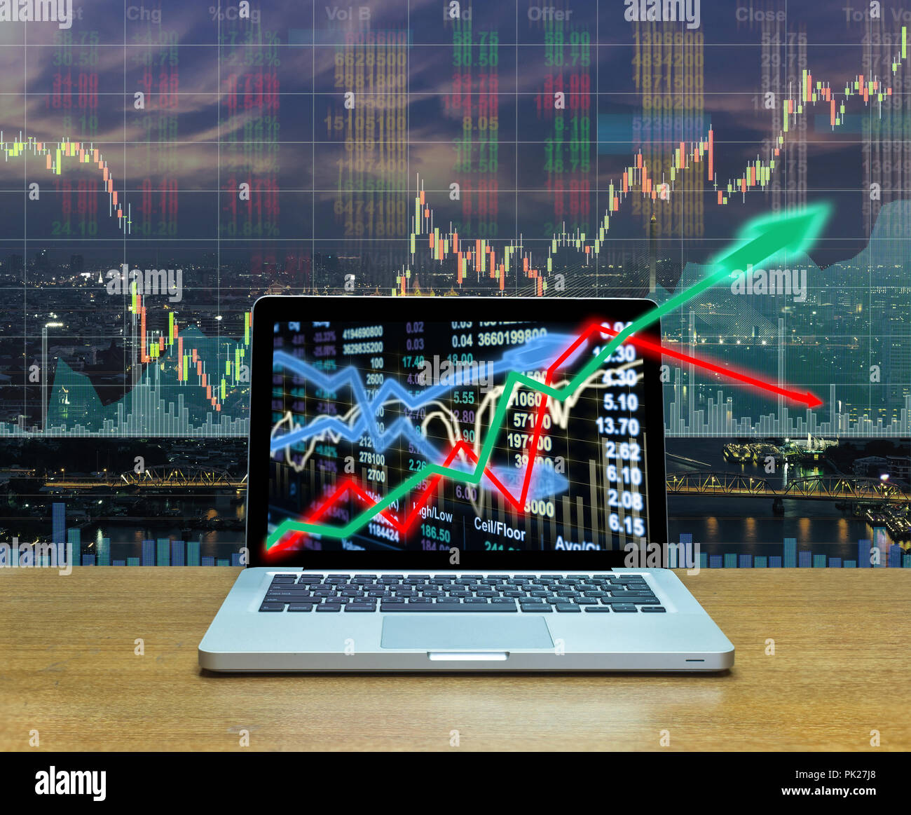 Stock exchange market trading graph over the screen of computer laptop ...