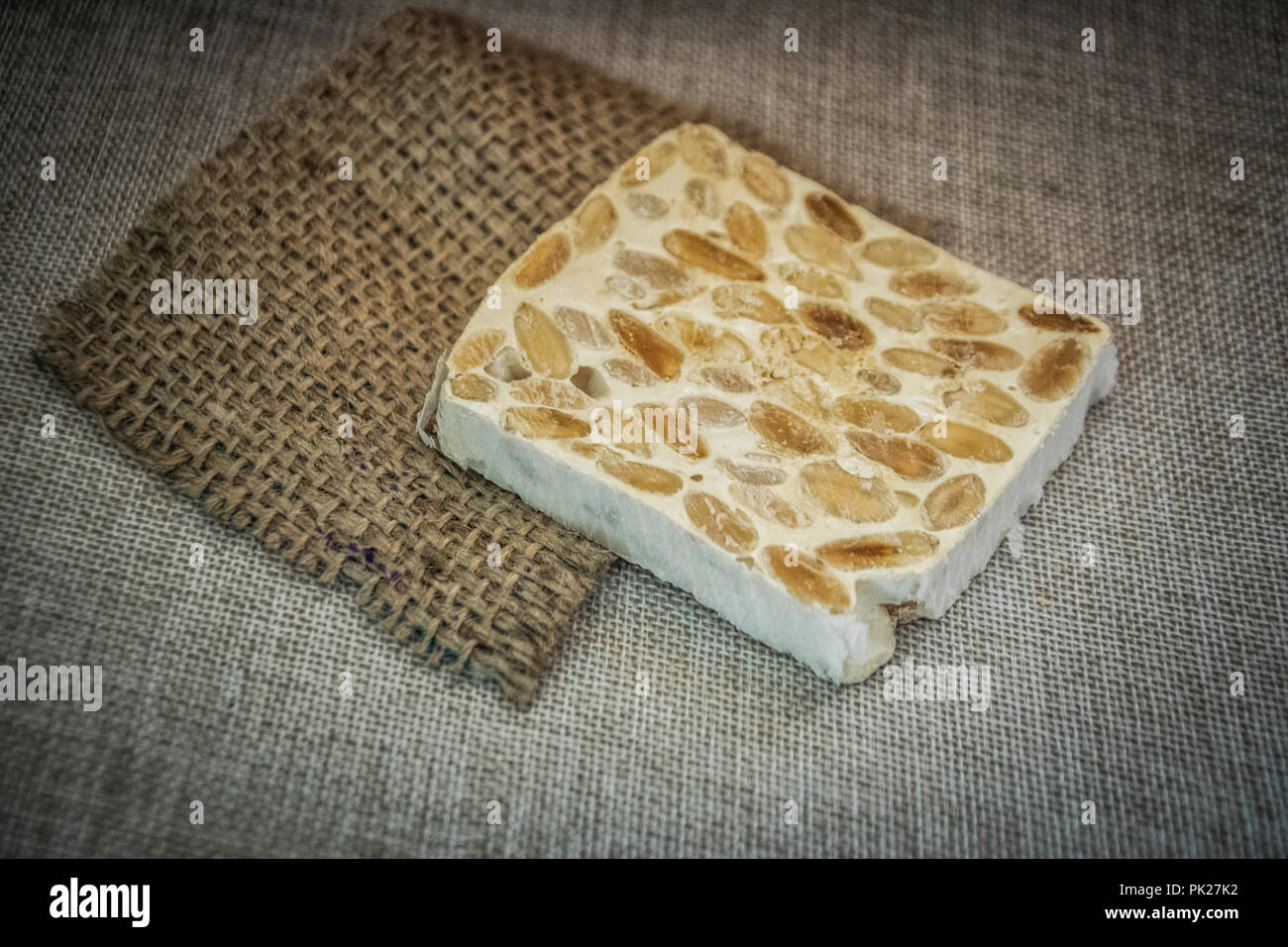 A piece of turron, traditional Spanish sweet Stock Photo - Alamy