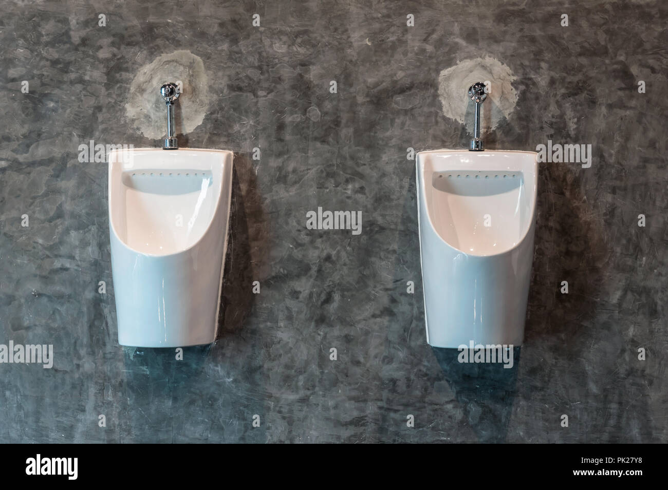 Urinal in male restroom Stock Photo - Alamy