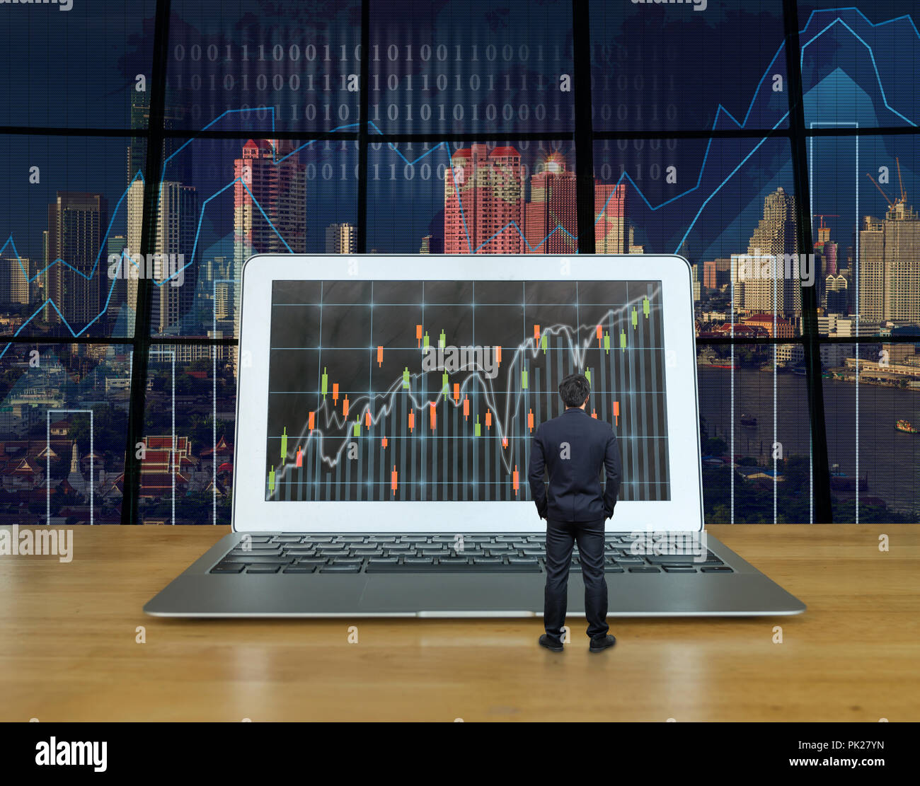 Businessman standing on the wood table which have the computer laptop ...