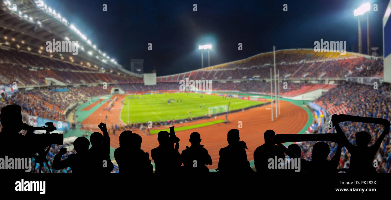 The silhouette of fan club over the panorama of Abstract blurred photo ...