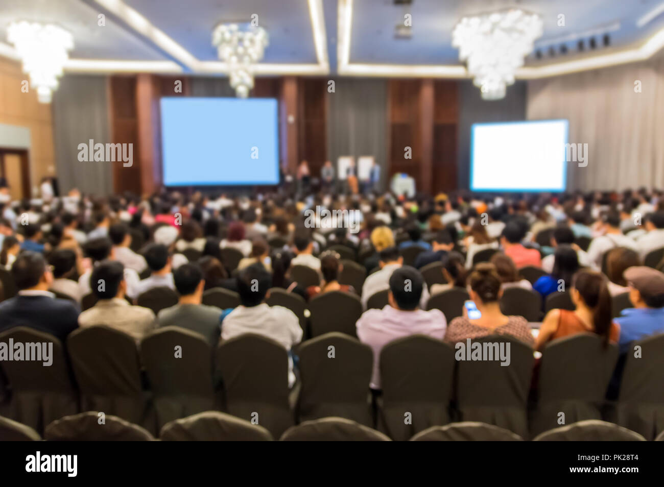 Abstract blurred photo of conference hall or seminar room with attendee ...