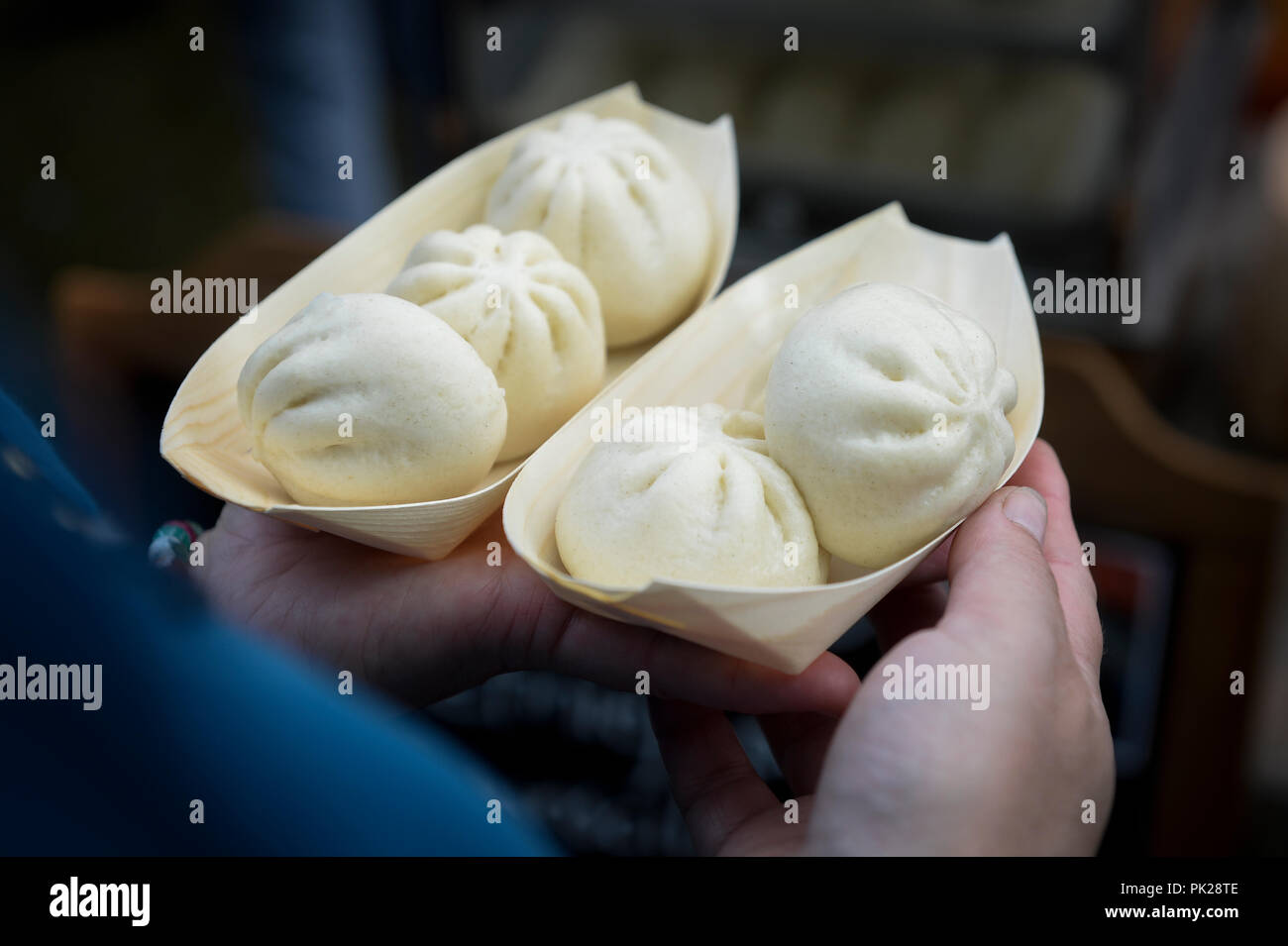A woman holds buckets of fresh dumplings at the Vietnam Culture ...