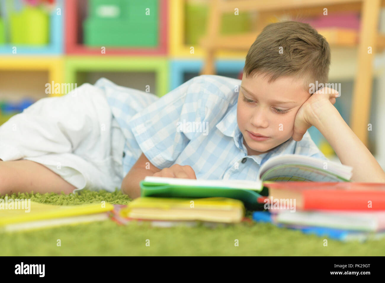 Portrait of young beautiful boy doing homework Stock Photo - Alamy