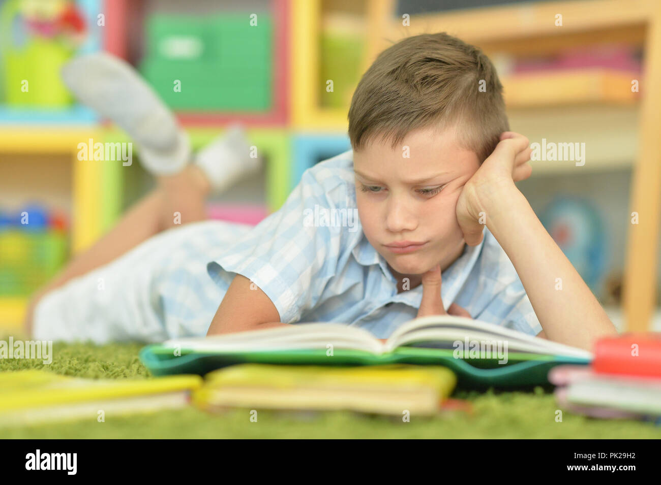 Portrait of young beautiful boy doing homework Stock Photo - Alamy