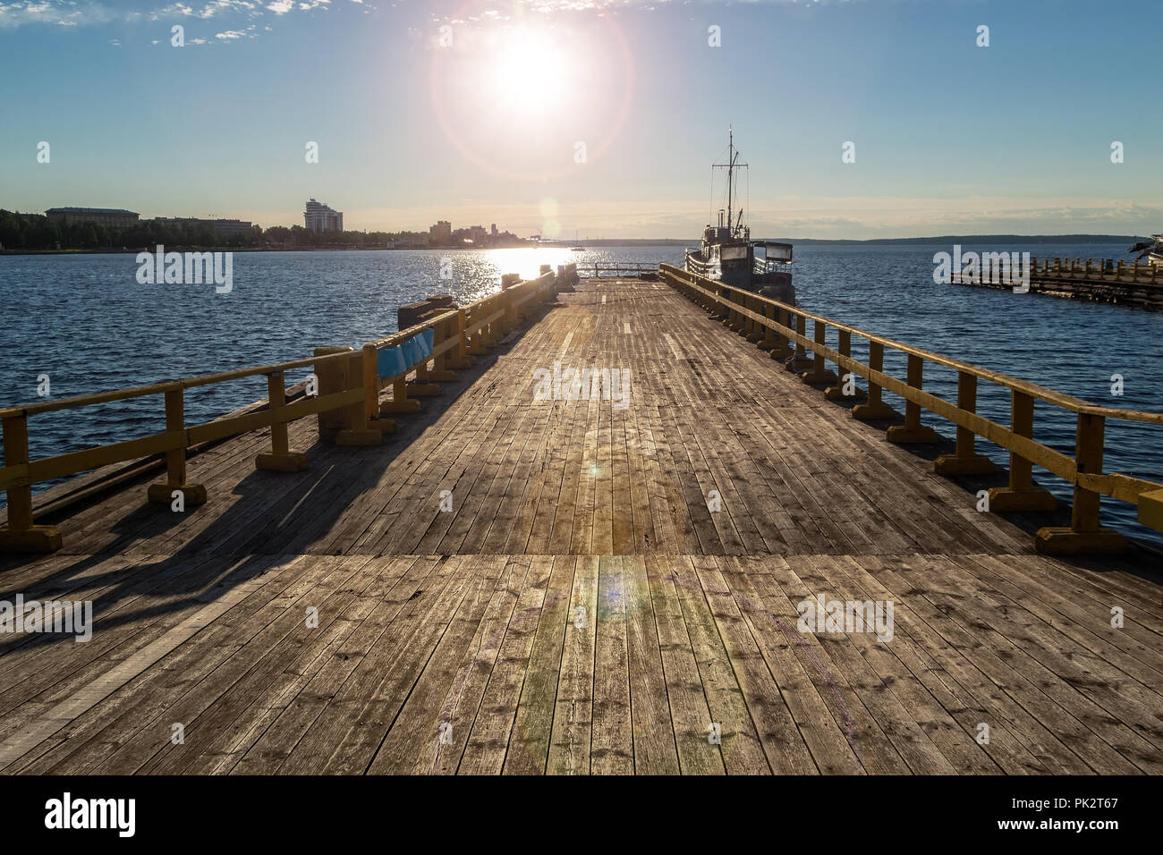 Wooden pier on the background of the sea Stock Photo - Alamy