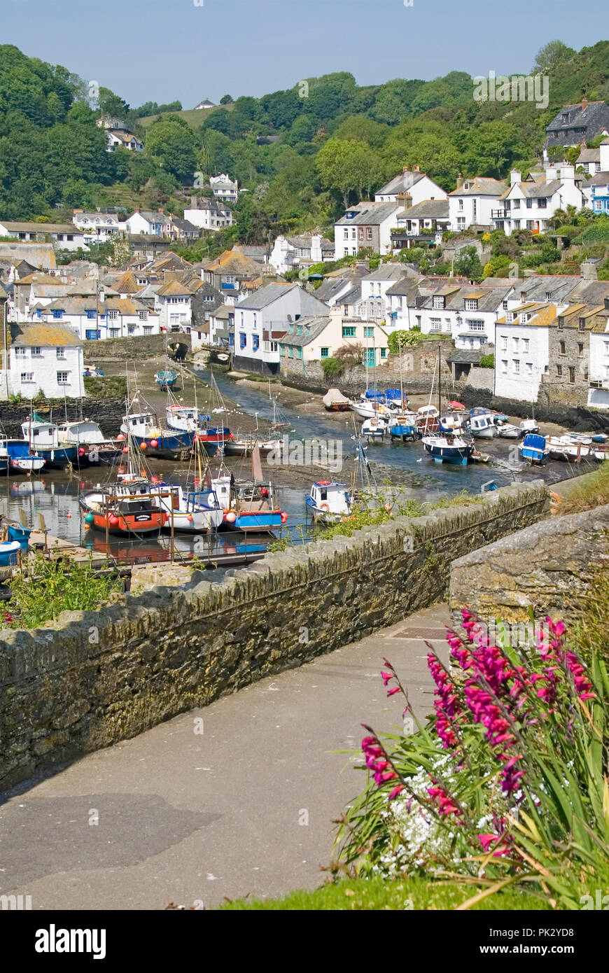Polperro Cornwall coast fishing boats low tide harbour in idyllic ...