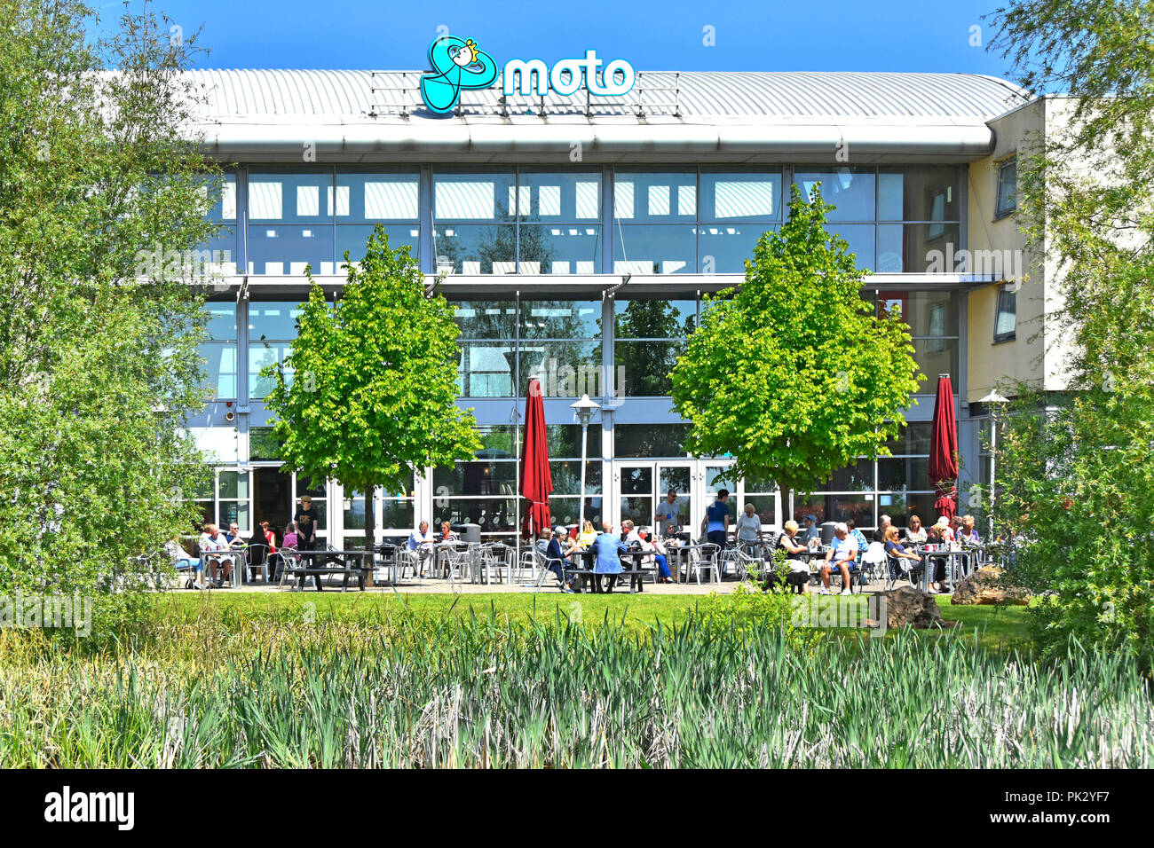 Moto Hospitality M1 motorway services logo & people break journey ...