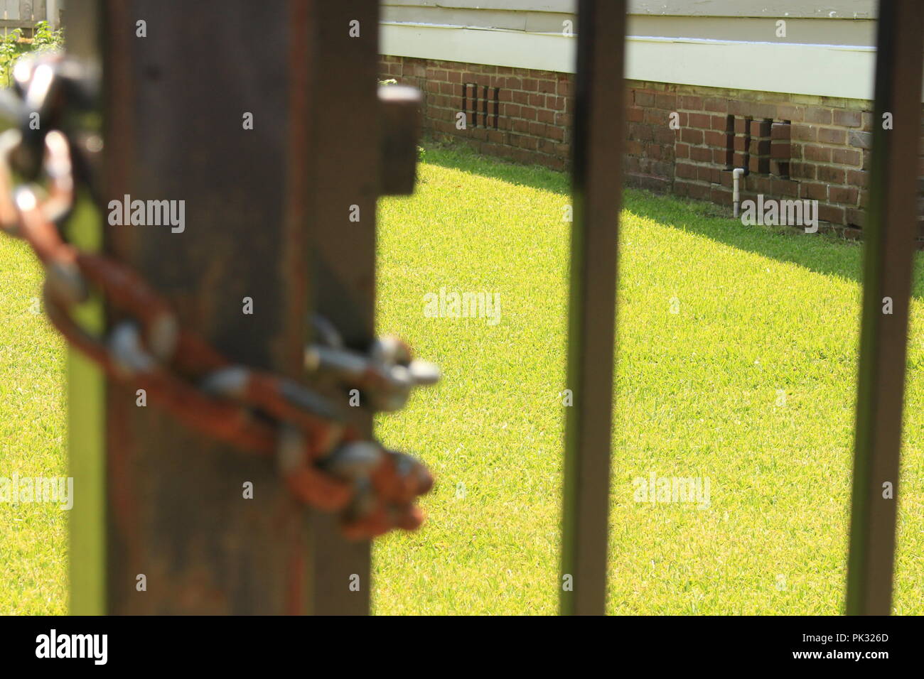 Chain around gate Stock Photo - Alamy