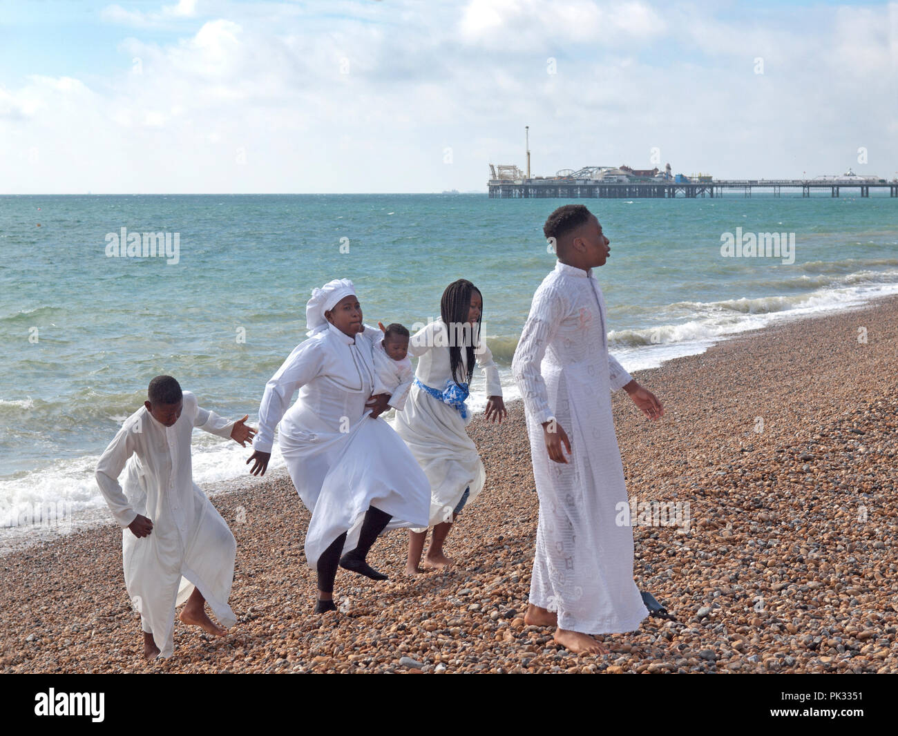 Members of an African Baptist Church gather on the beach at Brighton to ...