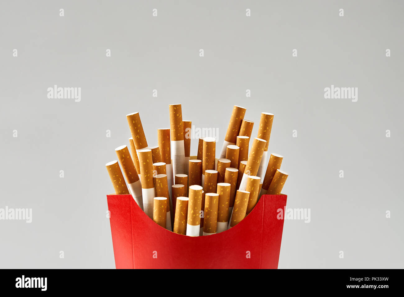 Many cigarettes in red carton, isolated studio shoot Stock Photo - Alamy