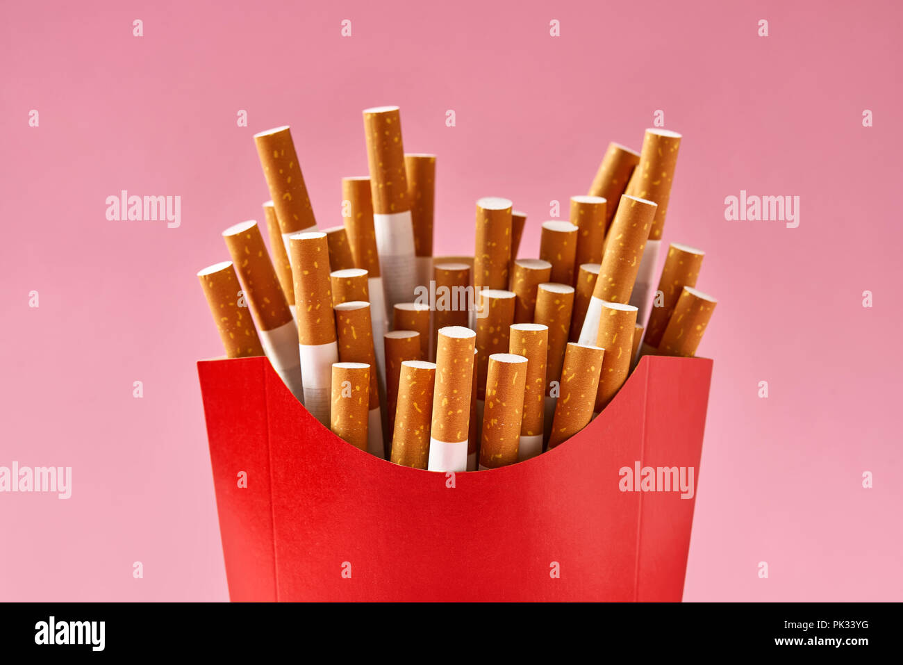 Many cigarettes in red carton, isolated studio shoot Stock Photo - Alamy