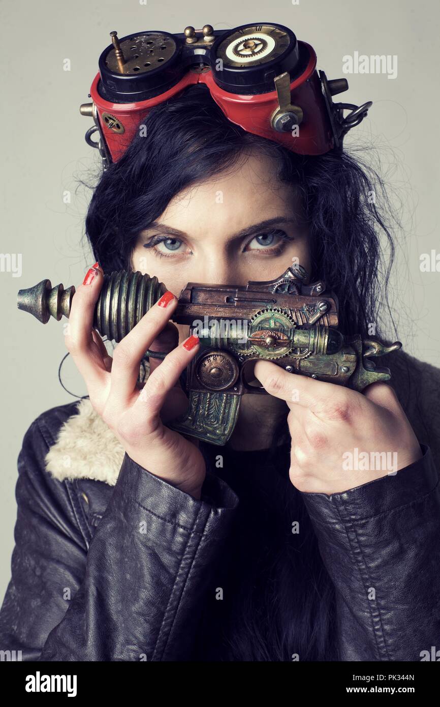 headshot dieselpunk girl with ray gun Stock Photo - Alamy