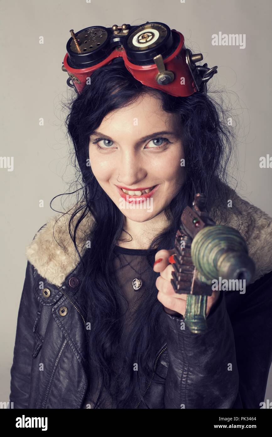 headshot dieselpunk girl with ray gun Stock Photo - Alamy