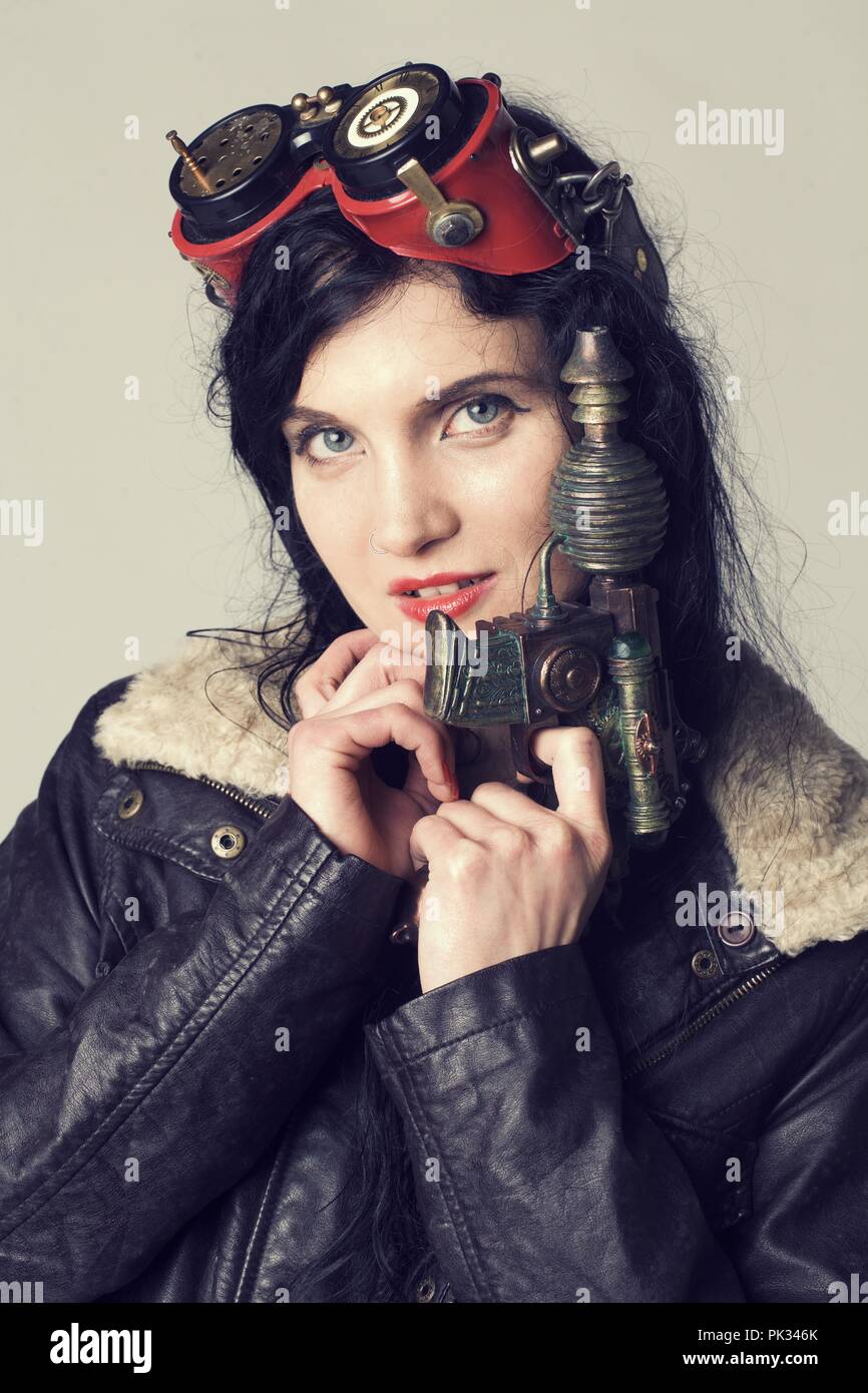 headshot dieselpunk girl with ray gun Stock Photo - Alamy
